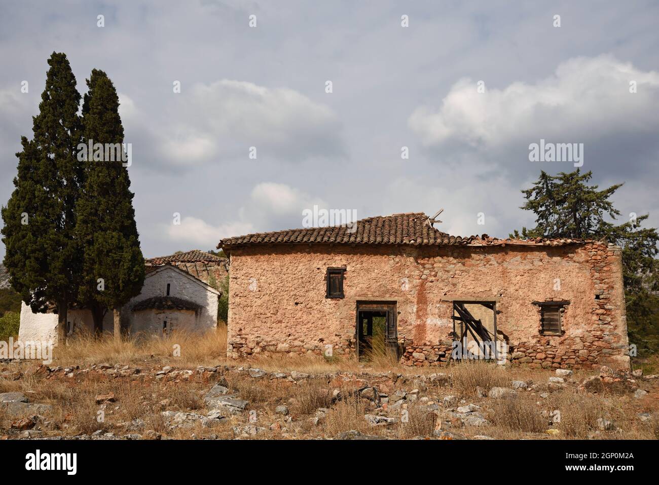Old abandoned claystone buildings and traditional Greek Orthodox ...