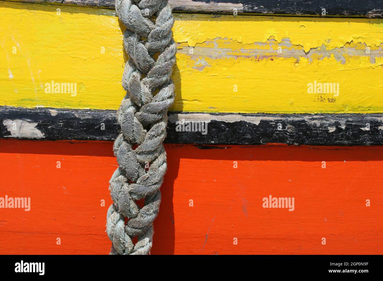 Hanging rope in a old, yellow and orange, boat Stock Photo - Alamy