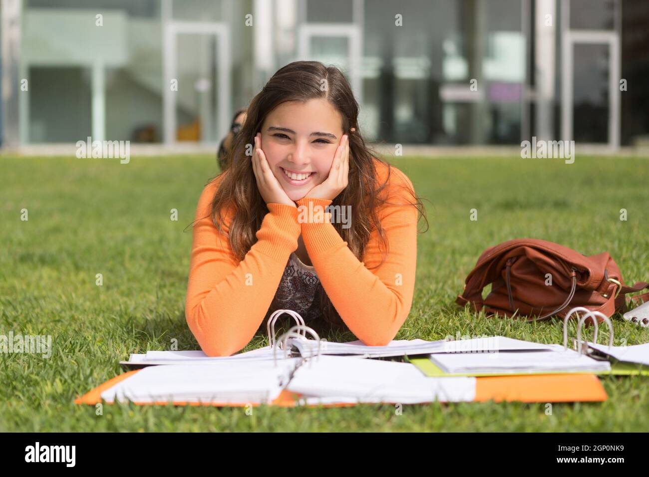 Young woman studying at the university campus Stock Photo - Alamy