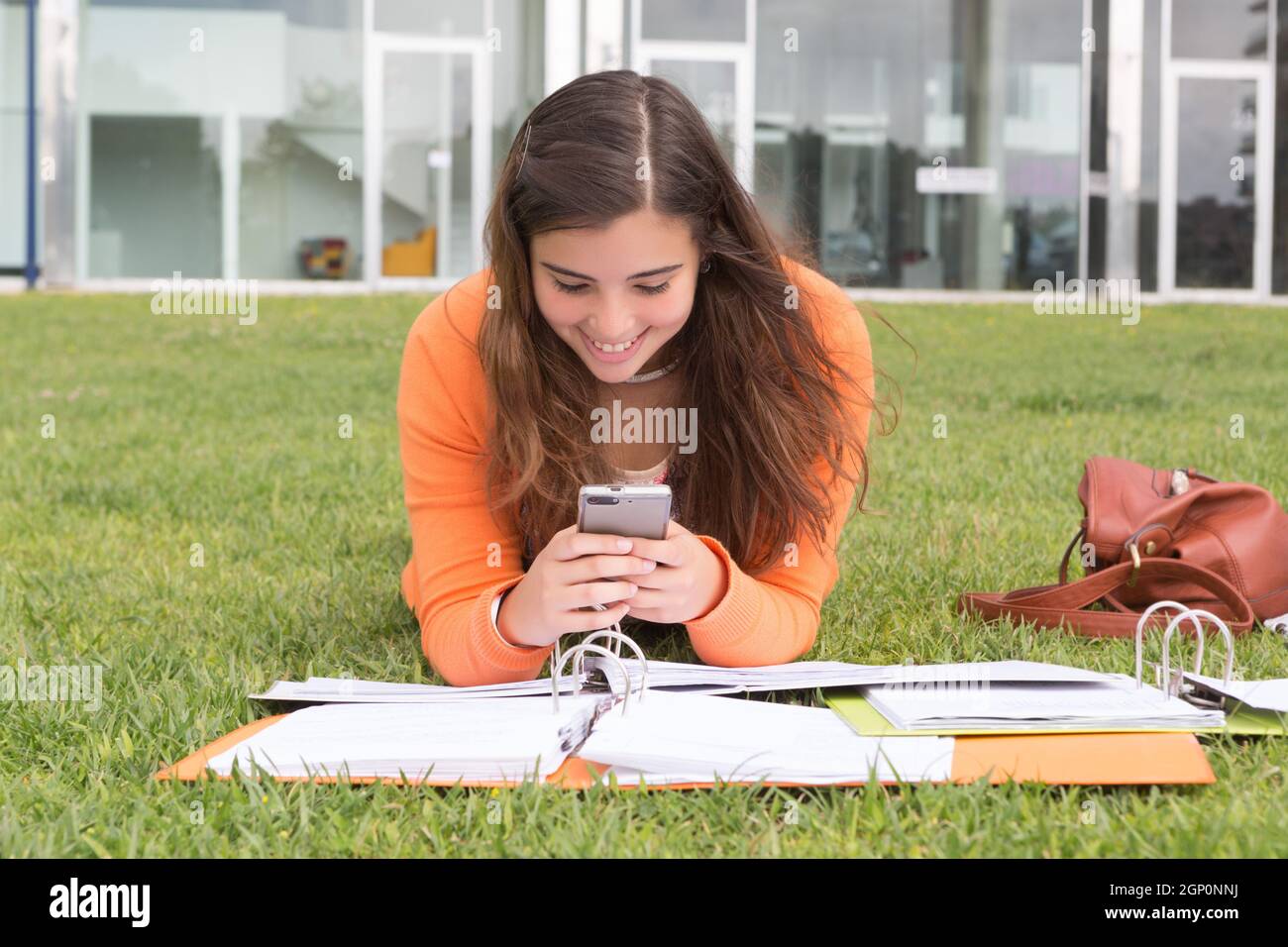 Young woman studying at the university campus Stock Photo - Alamy