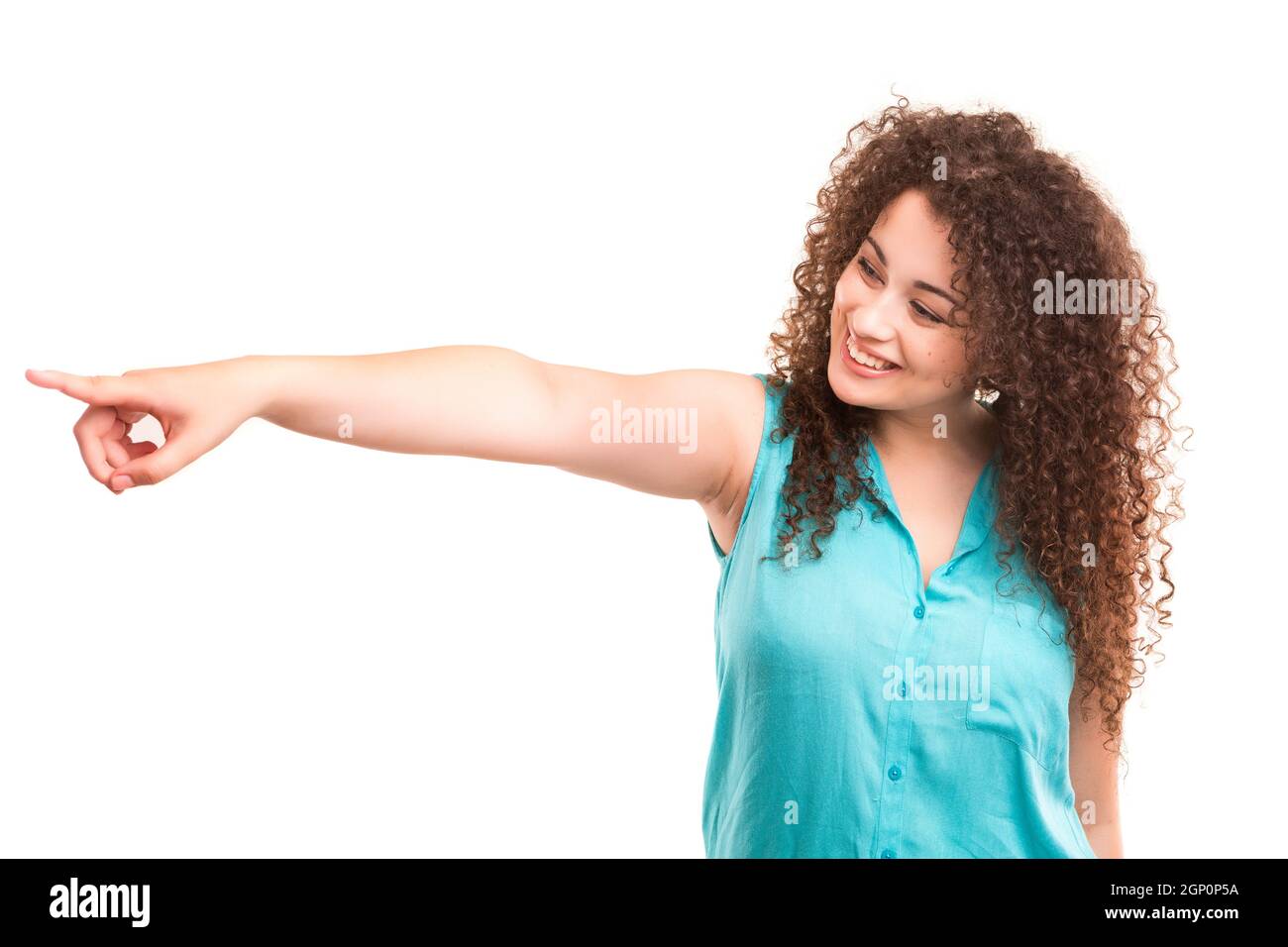 A beautiful woman pointing to something, isolated over a white ...