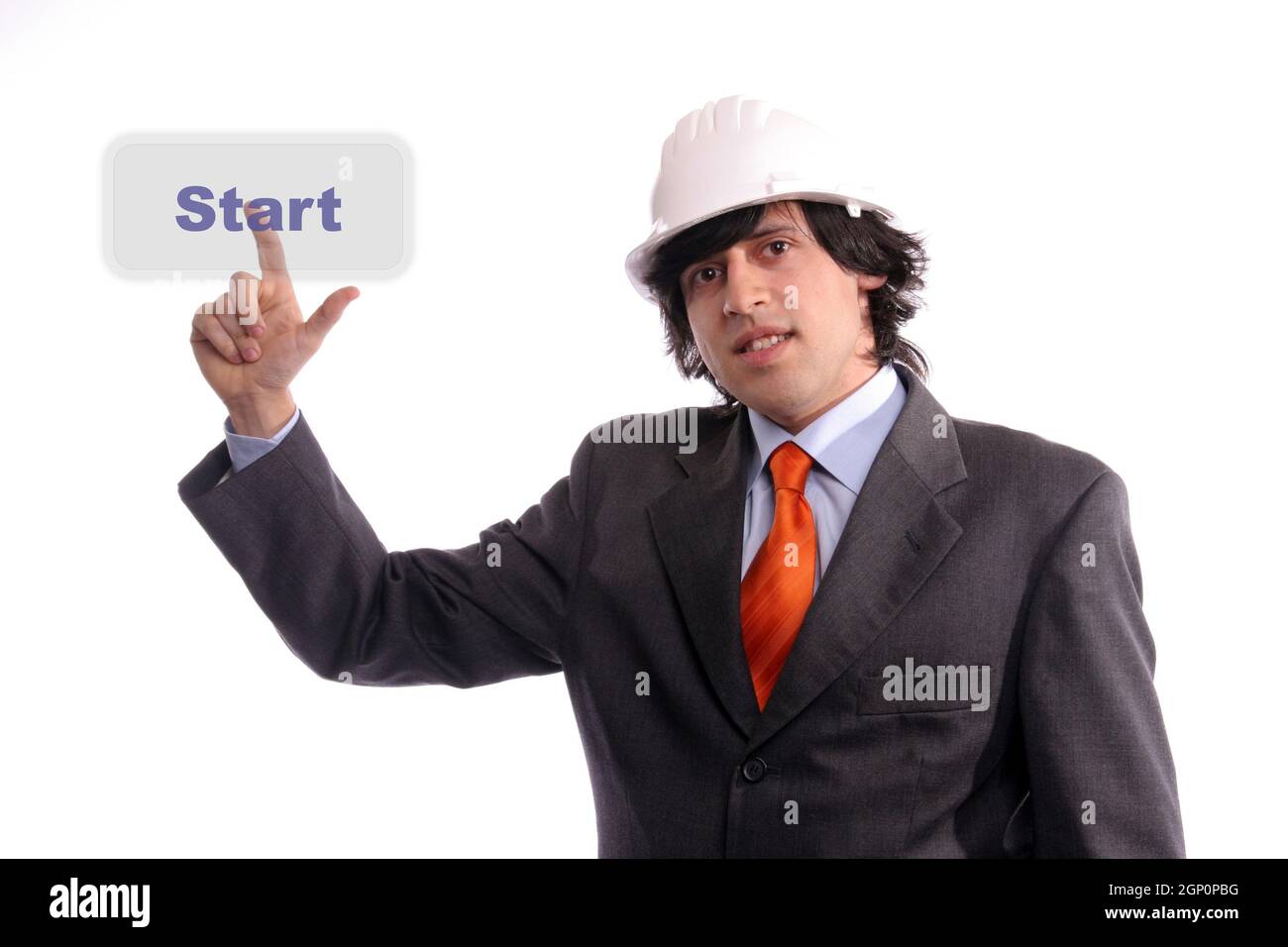 Young Engineer, presses the Start button, isolated in white background ...