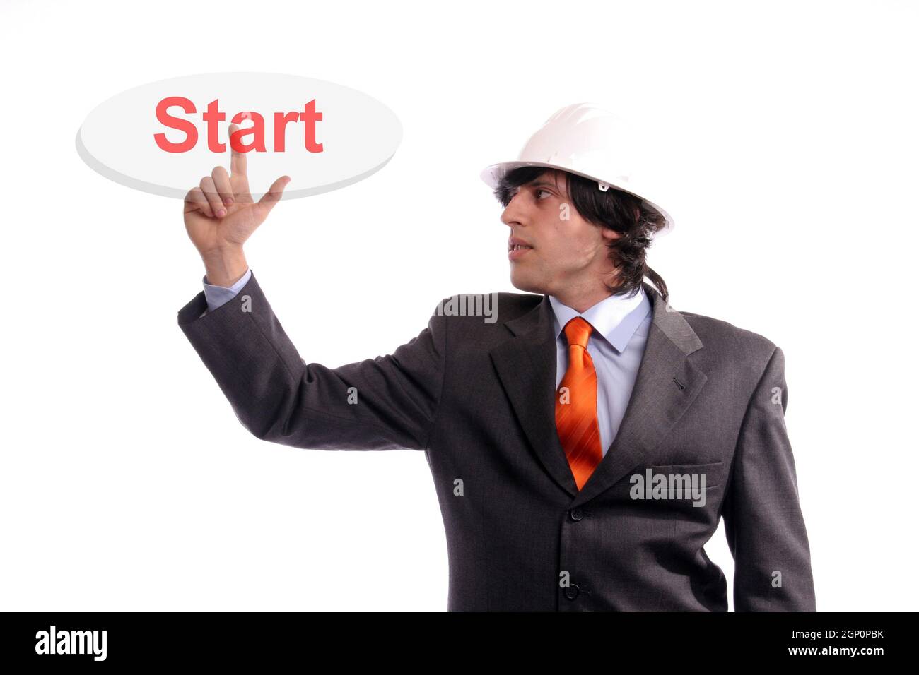 Young Engineer, presses the Start button, isolated in white background ...
