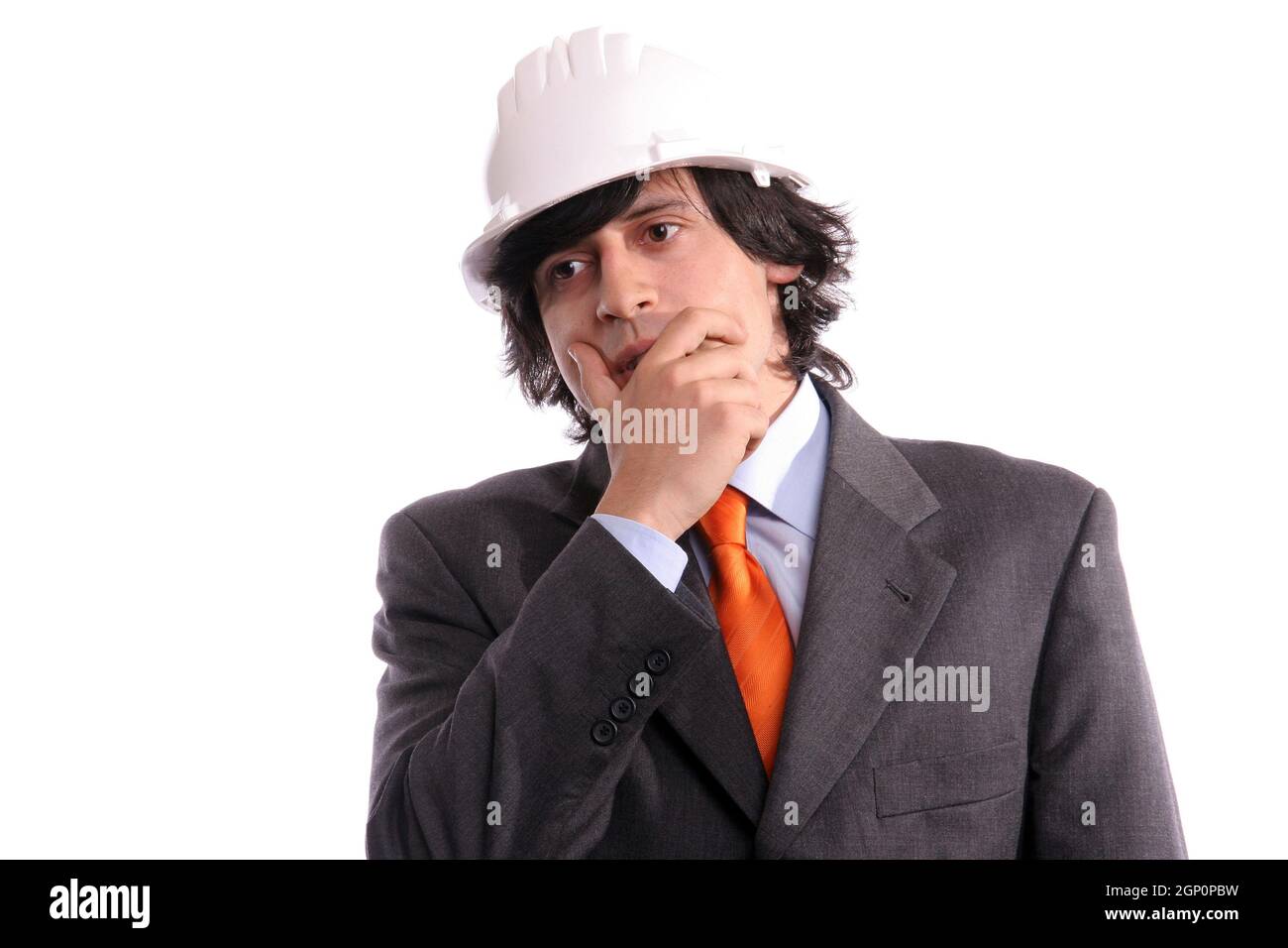 Young Engineer, full of thoughts, isolated in white background Stock ...