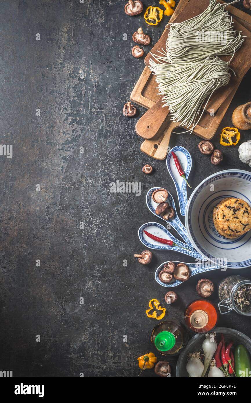 Food background with asian food ingredients: ramen noodles, shiitake ...