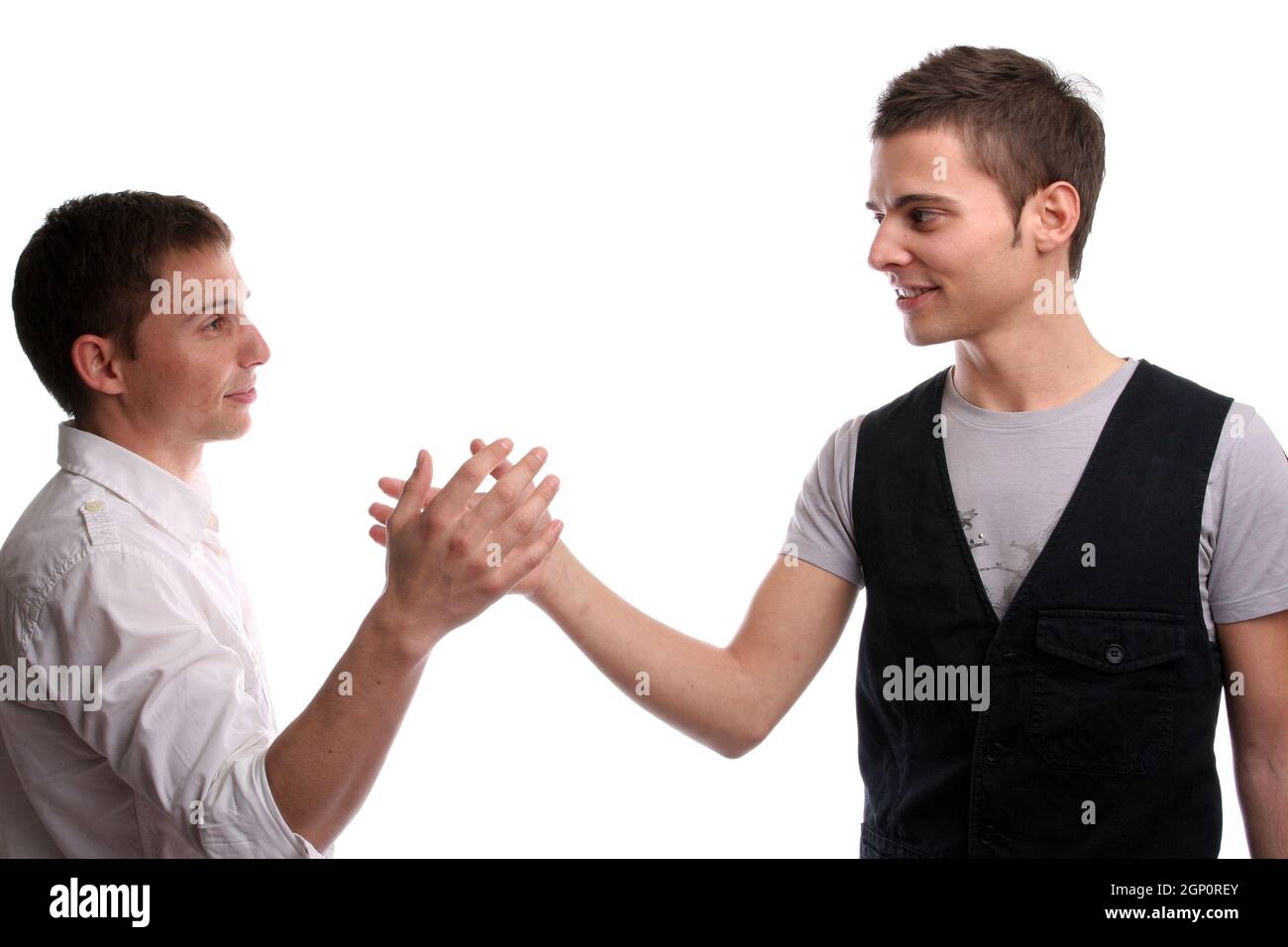 Two friends shaking hands, isolated in white background Stock Photo - Alamy