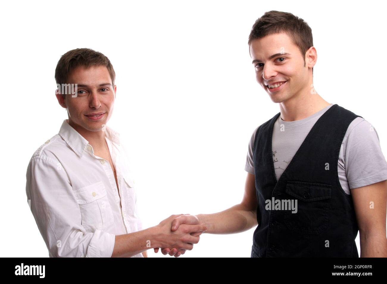 Two friends shaking hands, isolated in white background Stock Photo - Alamy