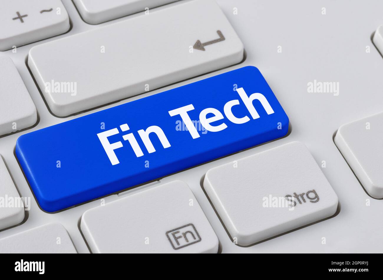 A keyboard with a blue button - Fin Tech Stock Photo - Alamy
