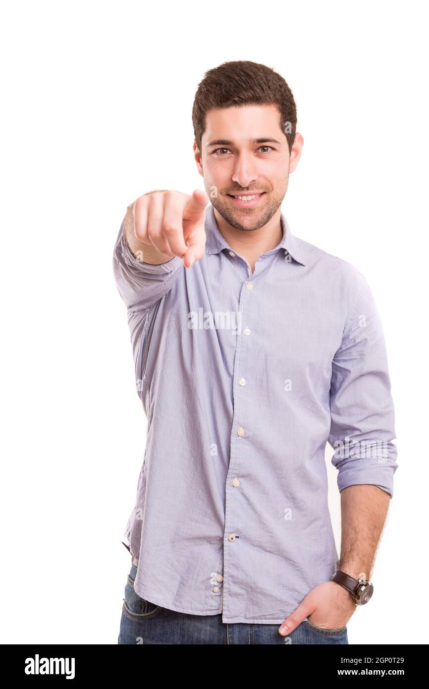Handsome young man pointing at you, isolated over white background ...