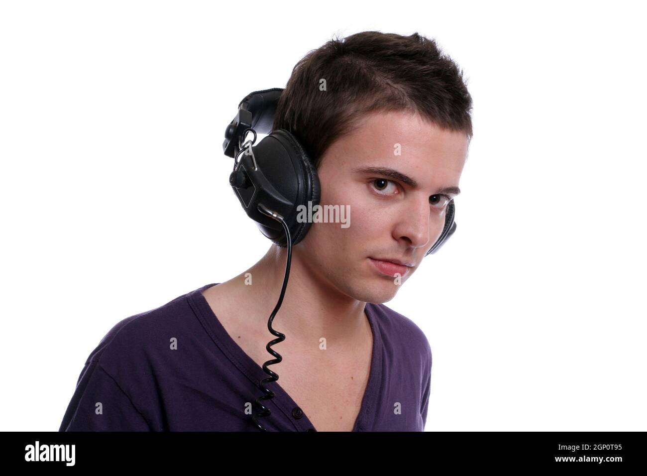 young casual man, listening to music, isolated in white background ...
