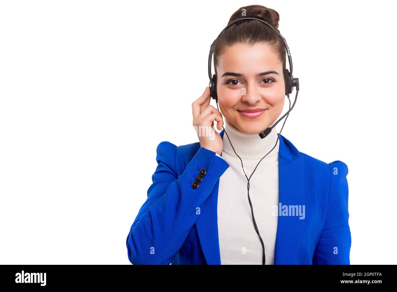 A friendly telephone operator smiling isolated over a white background ...
