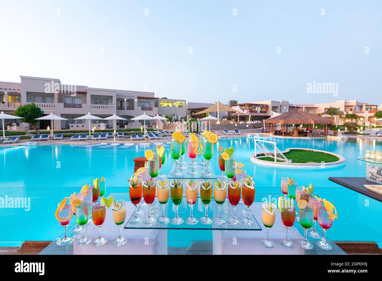 Pyramid of different coloured alcohol and non-alcohol Stock Photo - Alamy