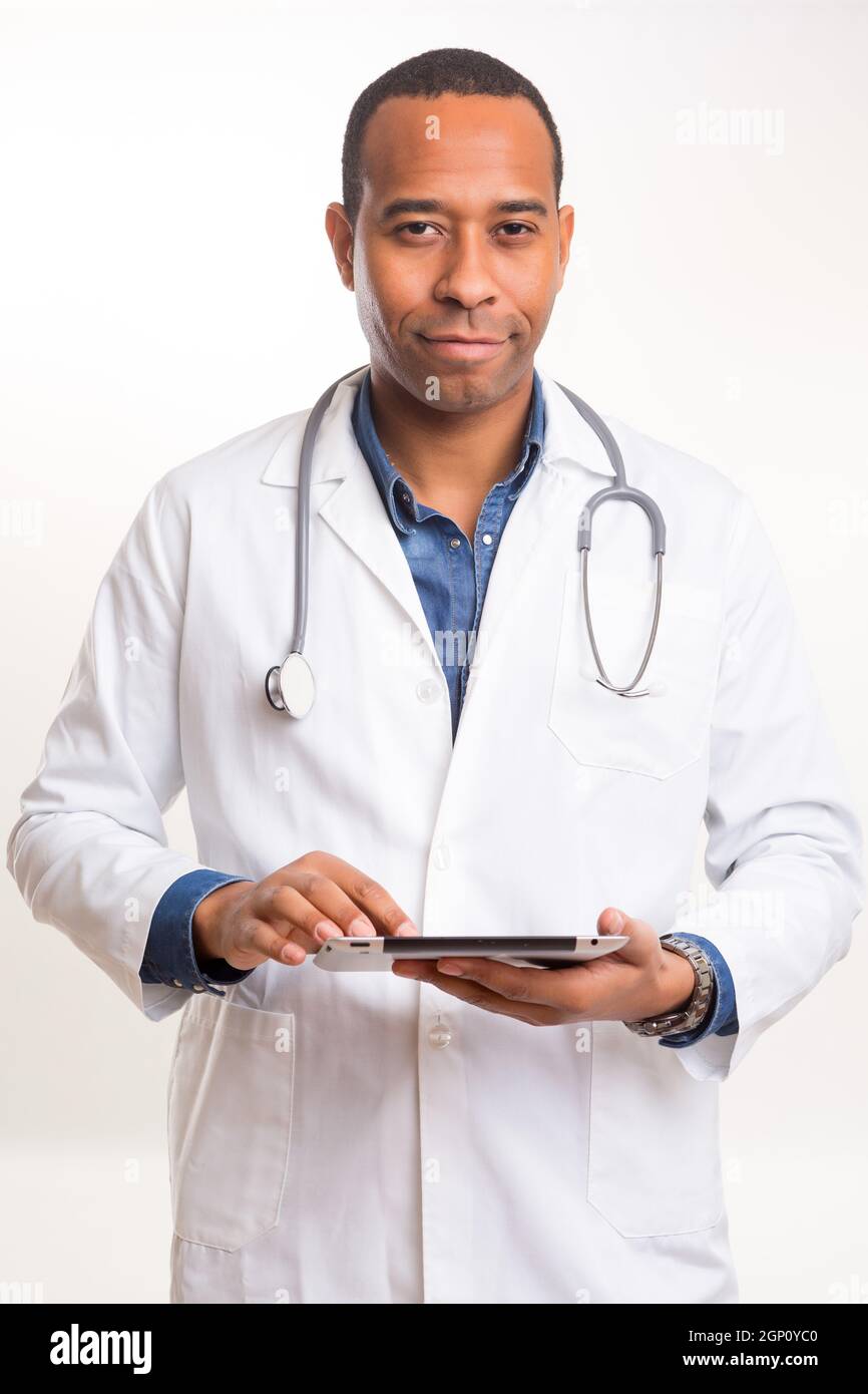 Handsome young african doctor posing isolated over a white background ...