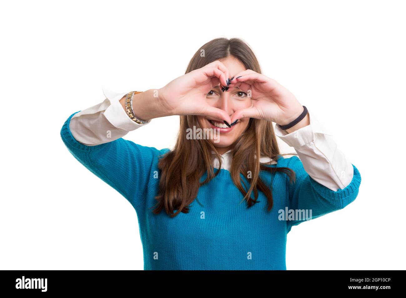 Beautiful woman making a heart shape with her hands, isolated over ...