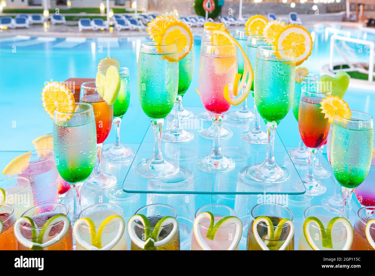 Pyramid of different coloured alcohol and non-alcohol Stock Photo - Alamy