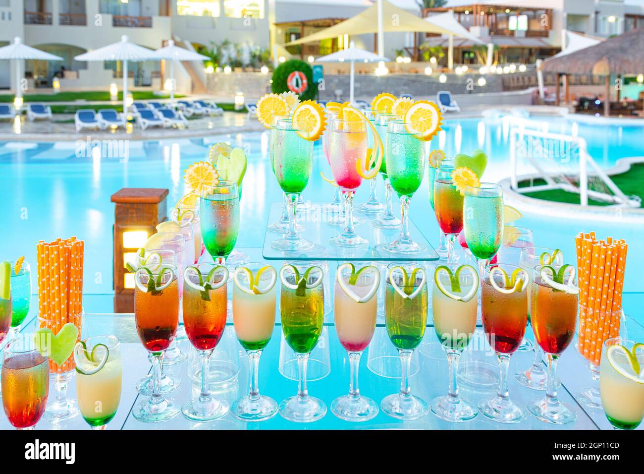 Pyramid of different coloured alcohol and non-alcohol Stock Photo - Alamy
