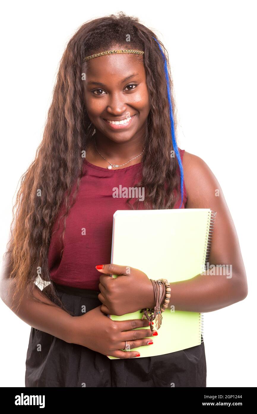Beautiful african student woman posing isolated over white background ...
