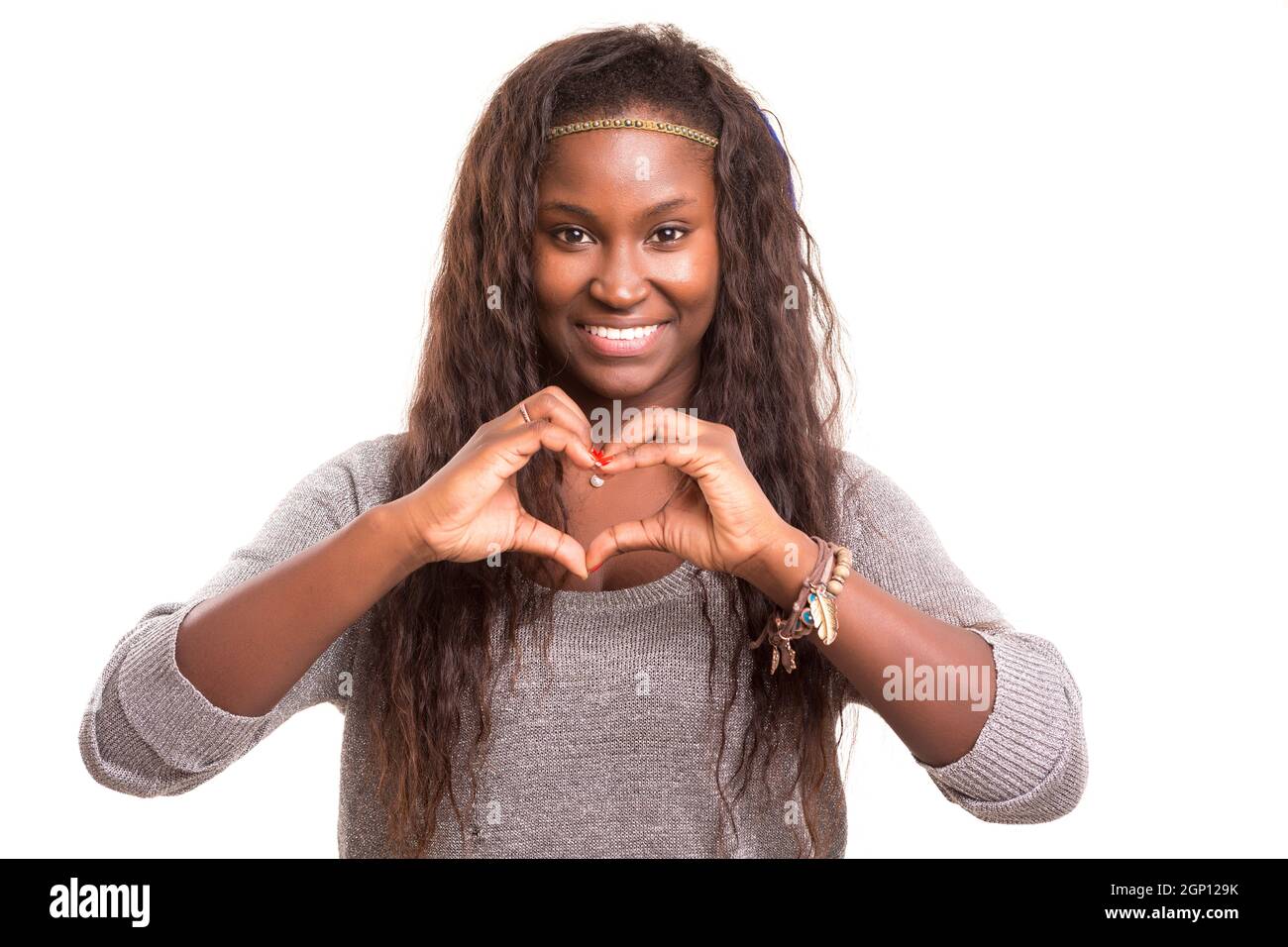 Beautiful woman making a heart shape with her hands, isolated over ...
