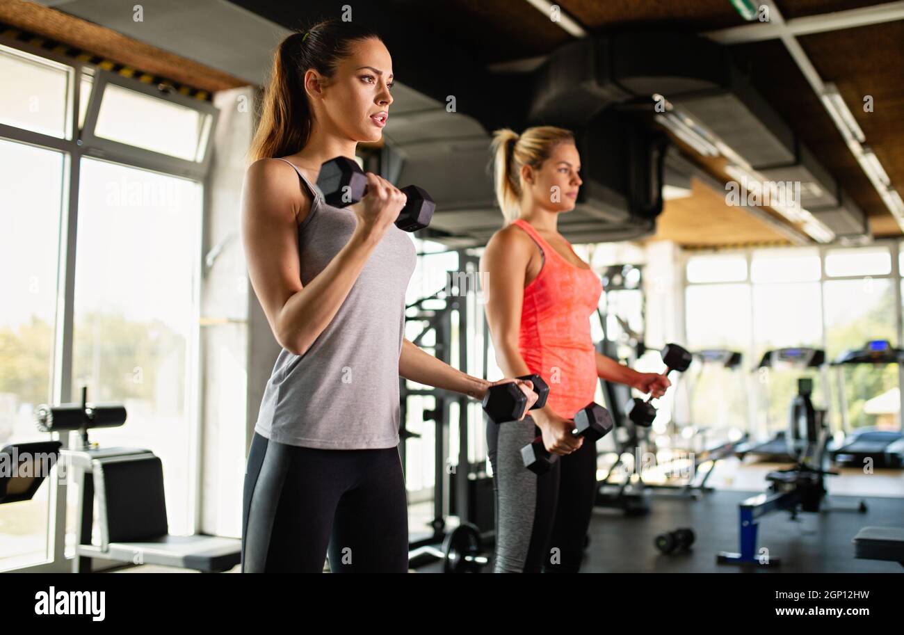 Sporty women working out together at gym. Sport healthy lifesytle ...