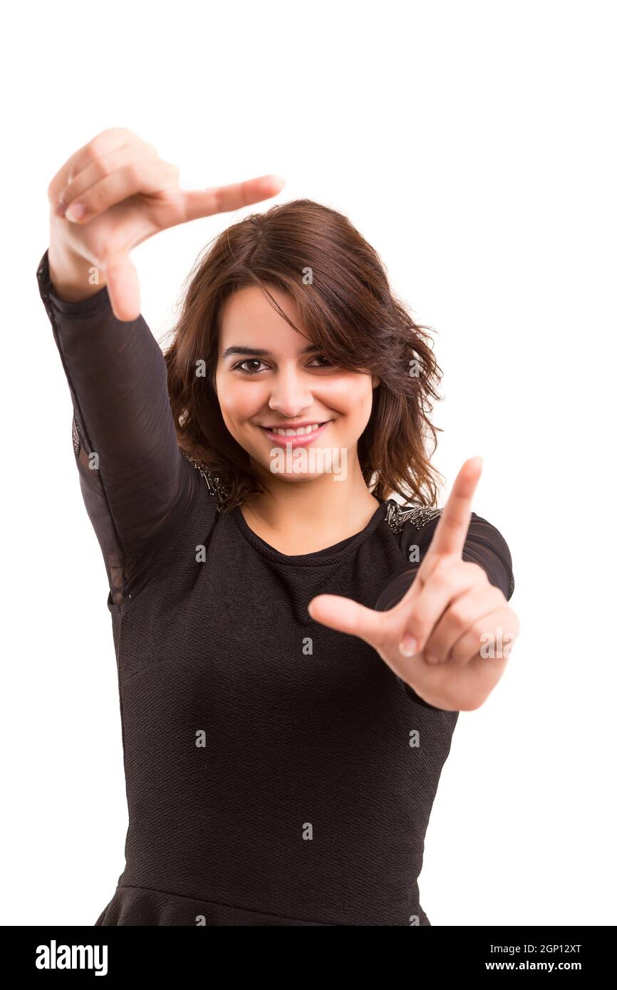 Young woman making framing key gesture - isolated over white Stock ...