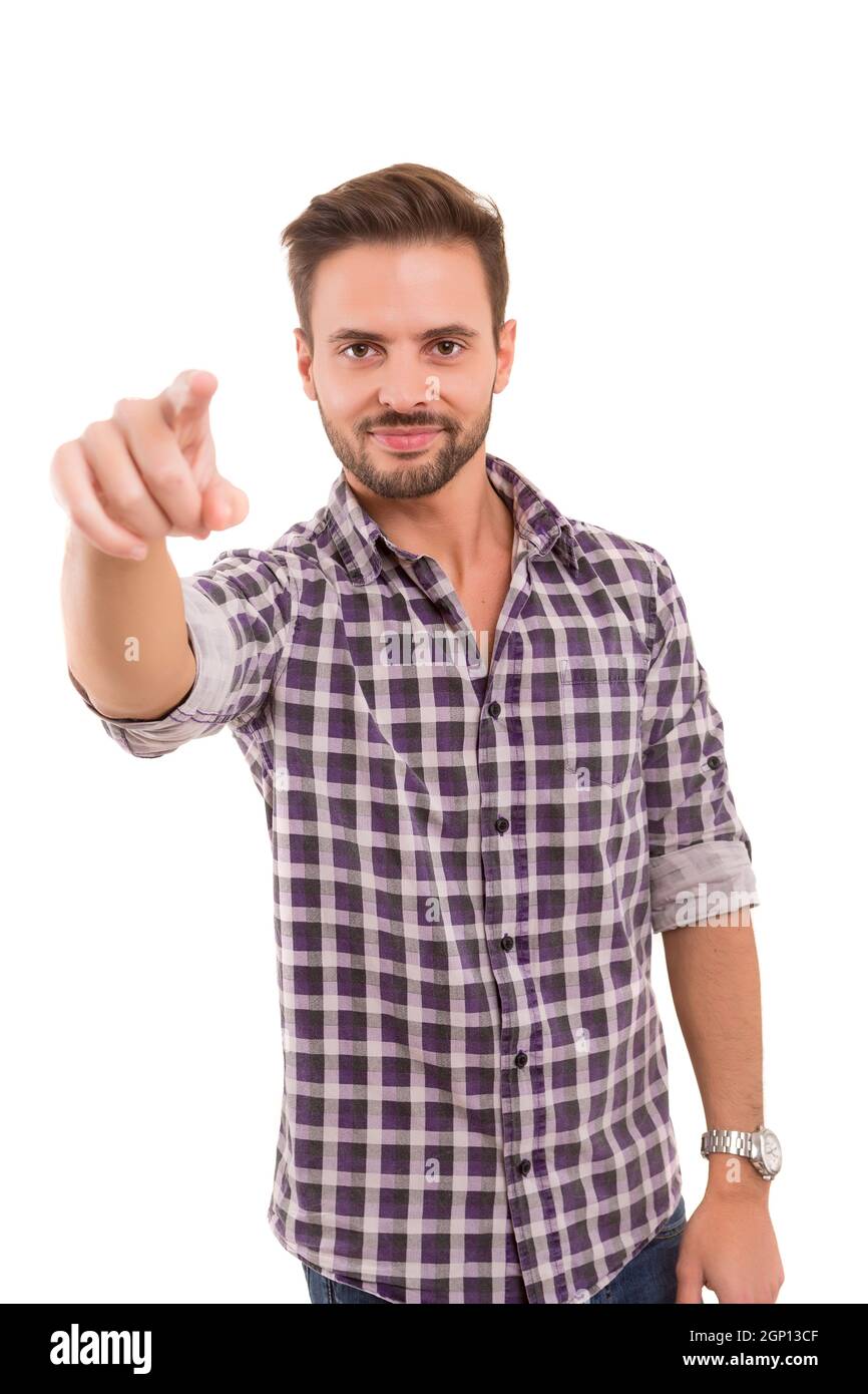 Handsome young man pointing at you, isolated over white background ...