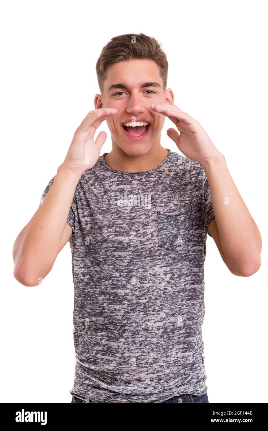Young man screaming at you, isolated over white background Stock Photo ...