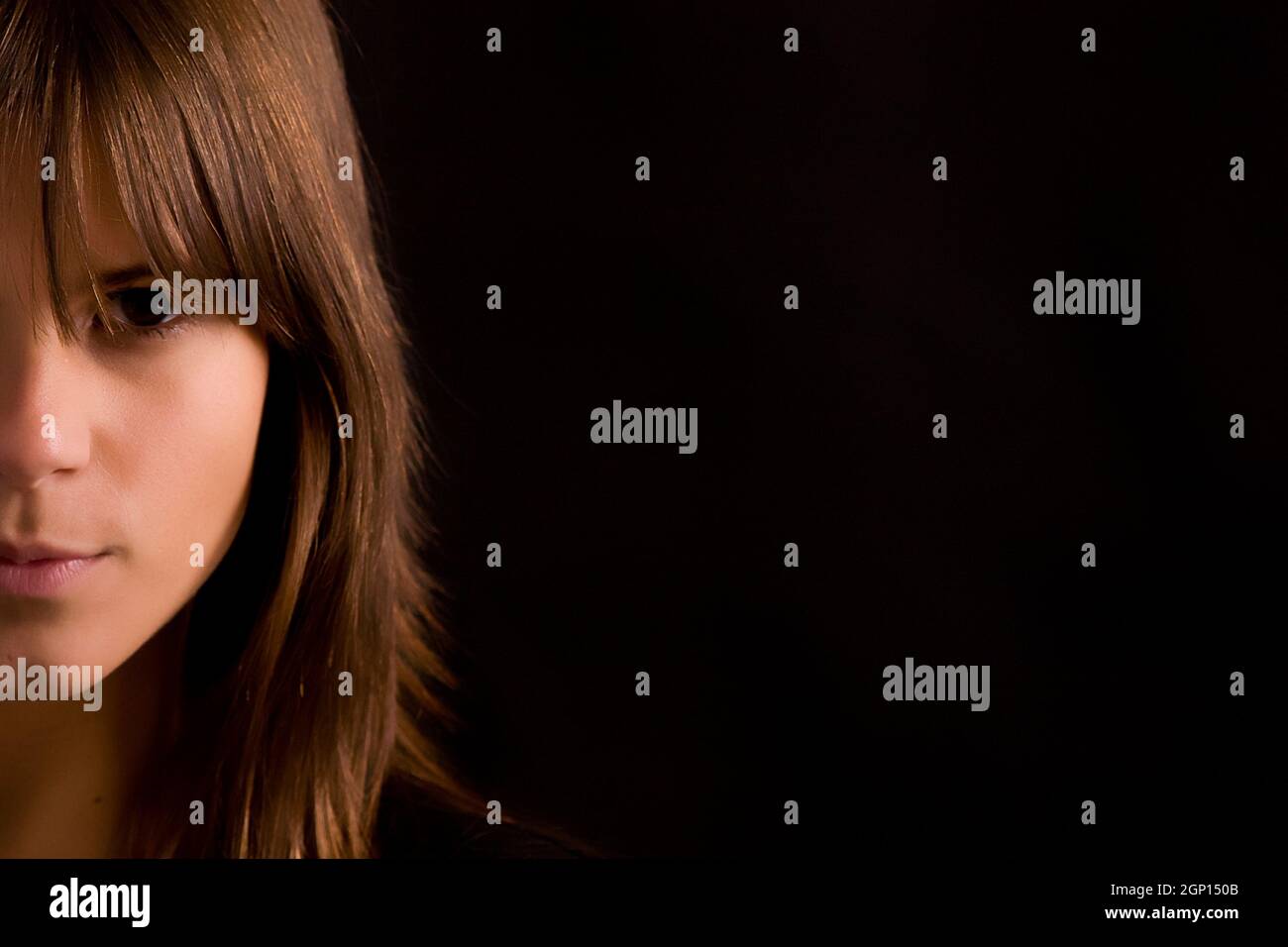 Low key portrait of a beautiful woman Stock Photo - Alamy