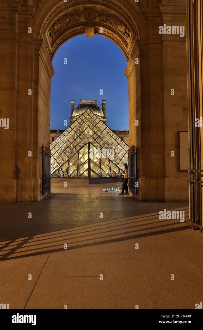 PARIS - OCTOBER 8, 2018 Louvre museum at twilight in summer. Louvre ...