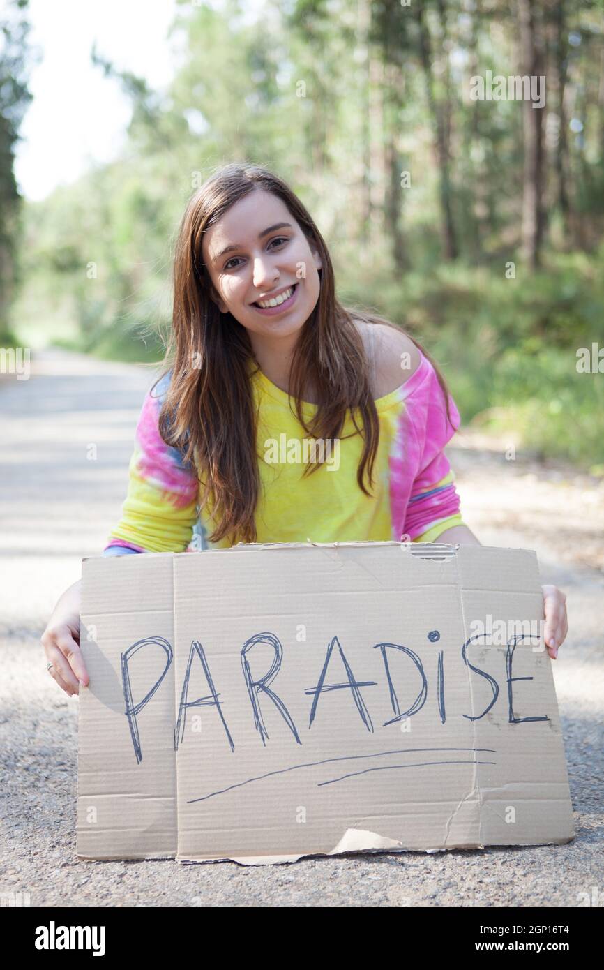 Pretty young woman holding a blank card Stock Photo - Alamy