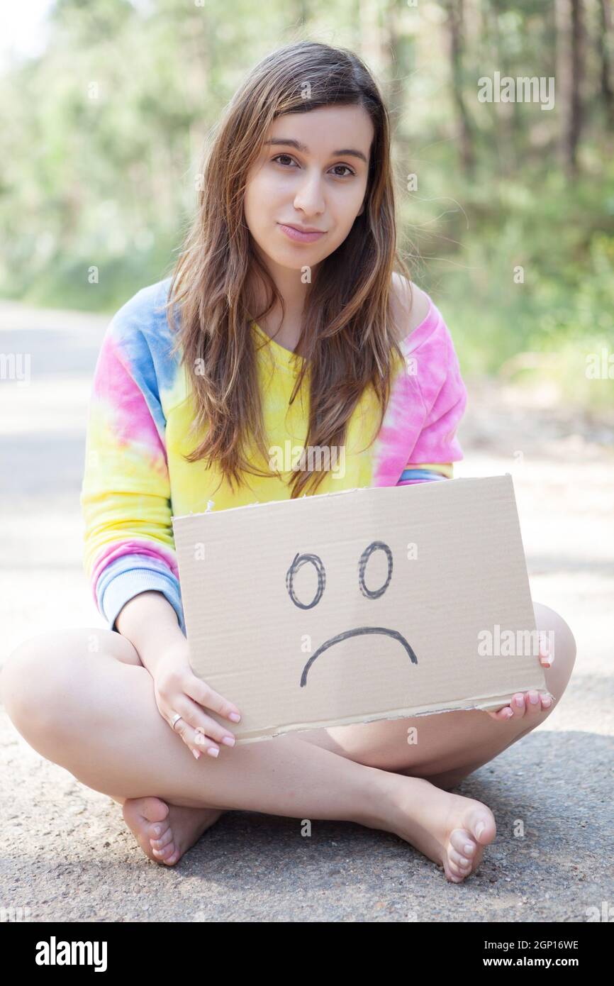 Pretty young woman holding a blank card Stock Photo - Alamy