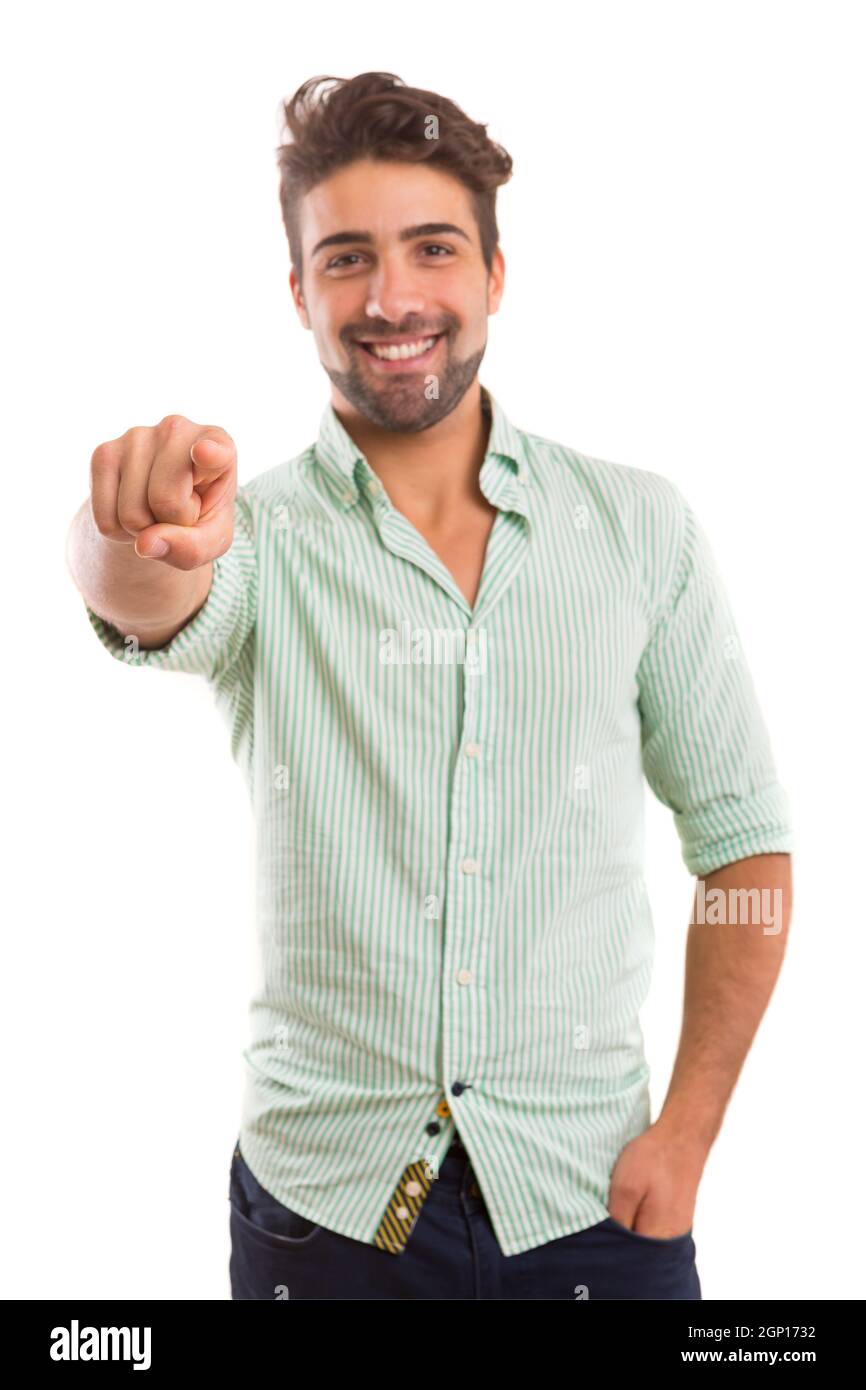 Handsome young man pointing at you, isolated over white background ...
