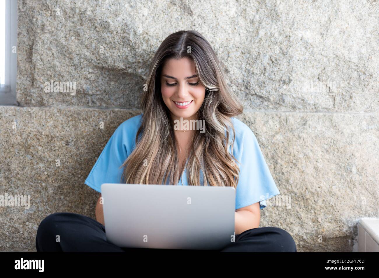 Beautiful young woman relaxing at home on her laptop computer Stock ...