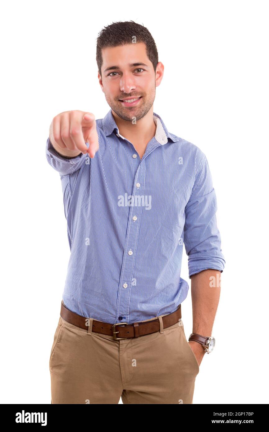 Handsome young man pointing at you, isolated over white background ...