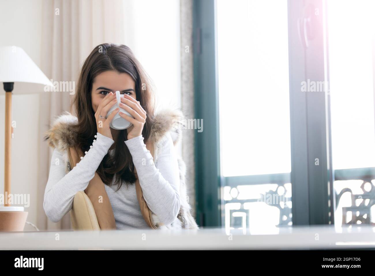 Woman relaxing at balcony enjoying sunrise. Good morning Stock Photo ...
