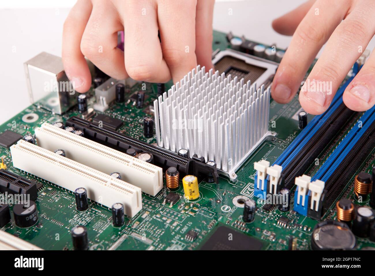 Computer engineer working on an old motherboard Stock Photo - Alamy