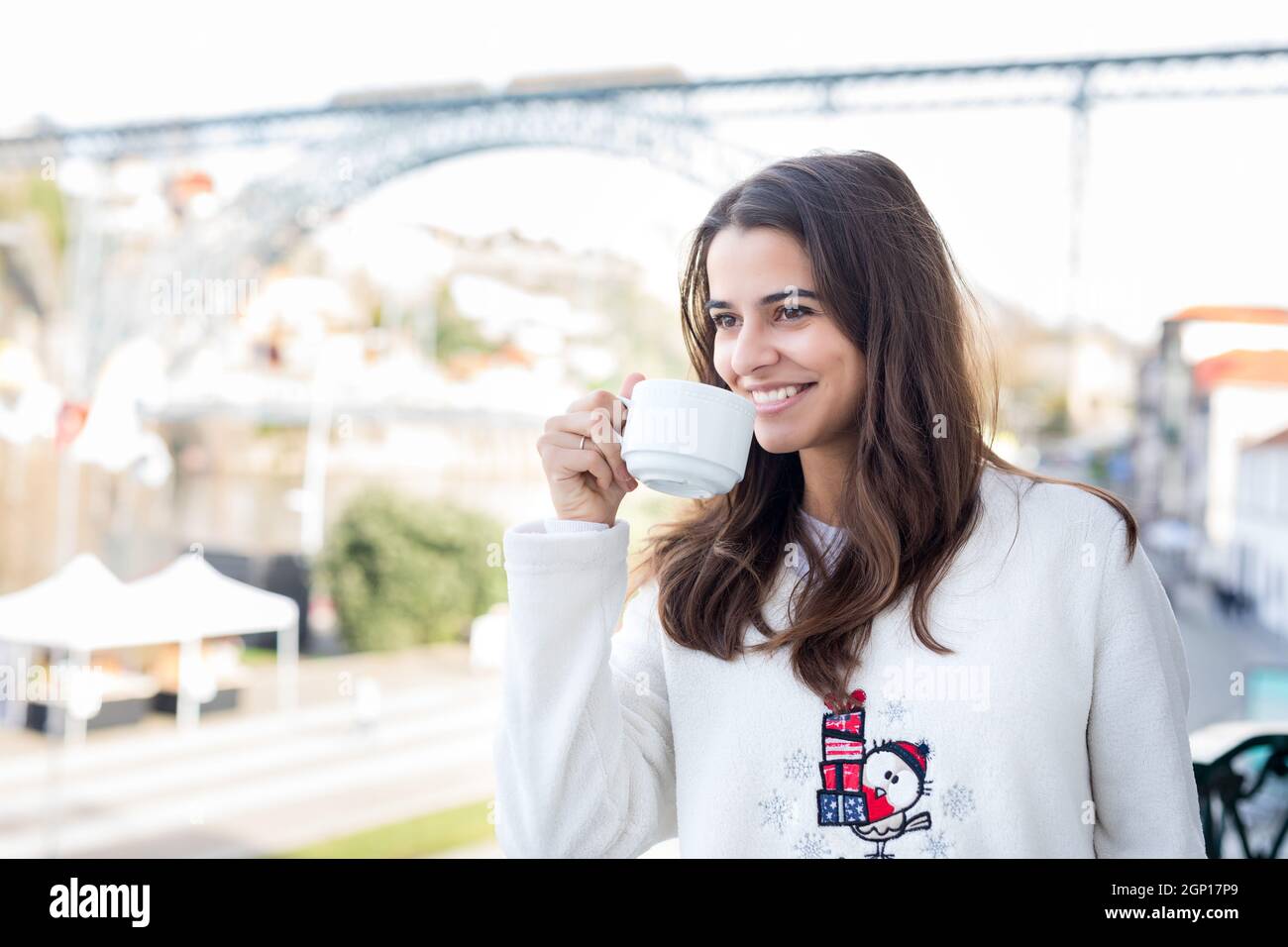 Woman relaxing at balcony enjoying sunrise. Good morning Stock Photo ...