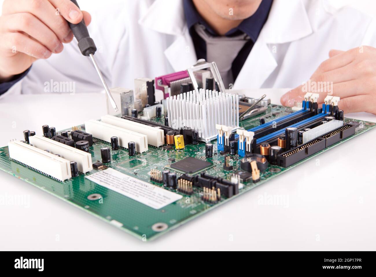 Computer engineer working on an old motherboard Stock Photo - Alamy