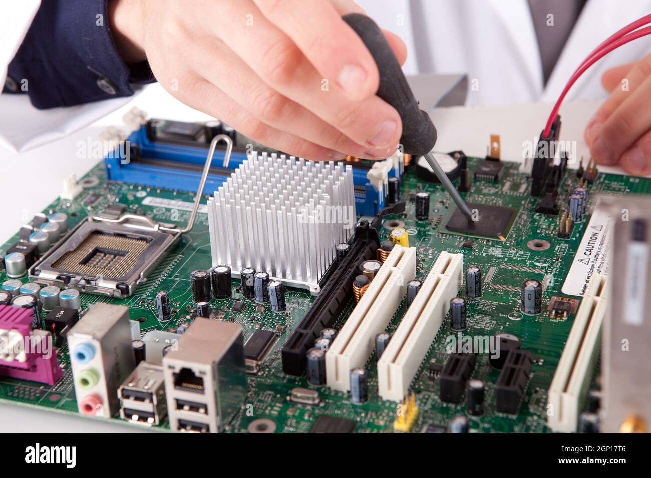 Computer engineer working on an old motherboard Stock Photo - Alamy
