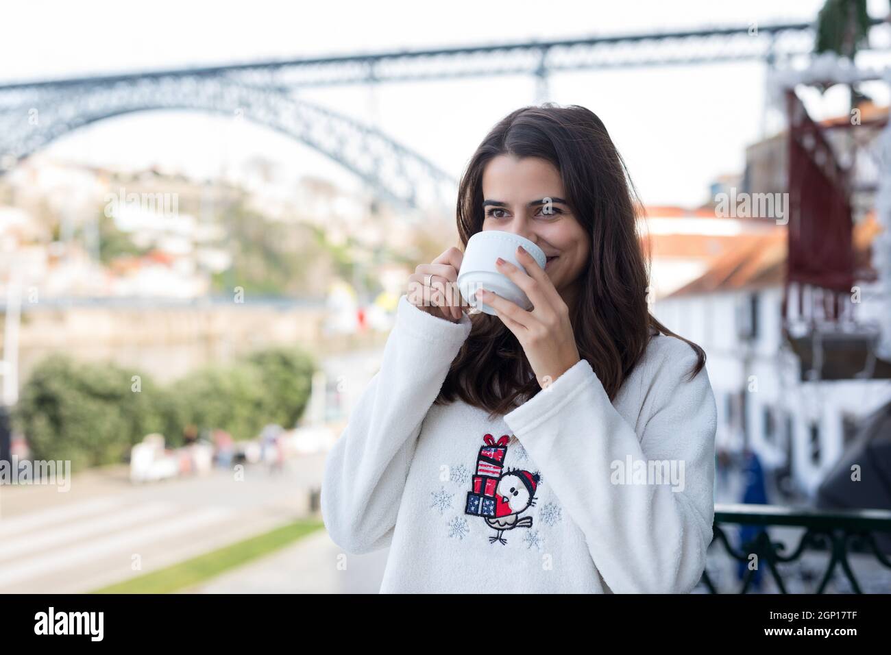 Woman relaxing at balcony enjoying sunrise. Good morning Stock Photo ...