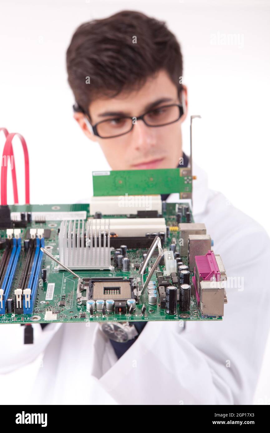 Computer engineer working on an old motherboard Stock Photo - Alamy