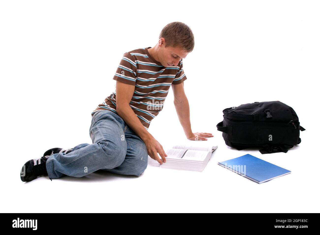 Young man studying, isolated over white background Stock Photo - Alamy
