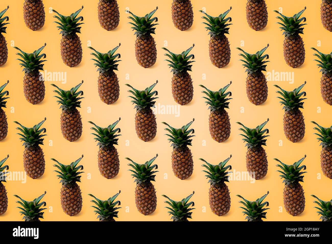 Colorful fruit pattern of pineapple on light orange background with ...
