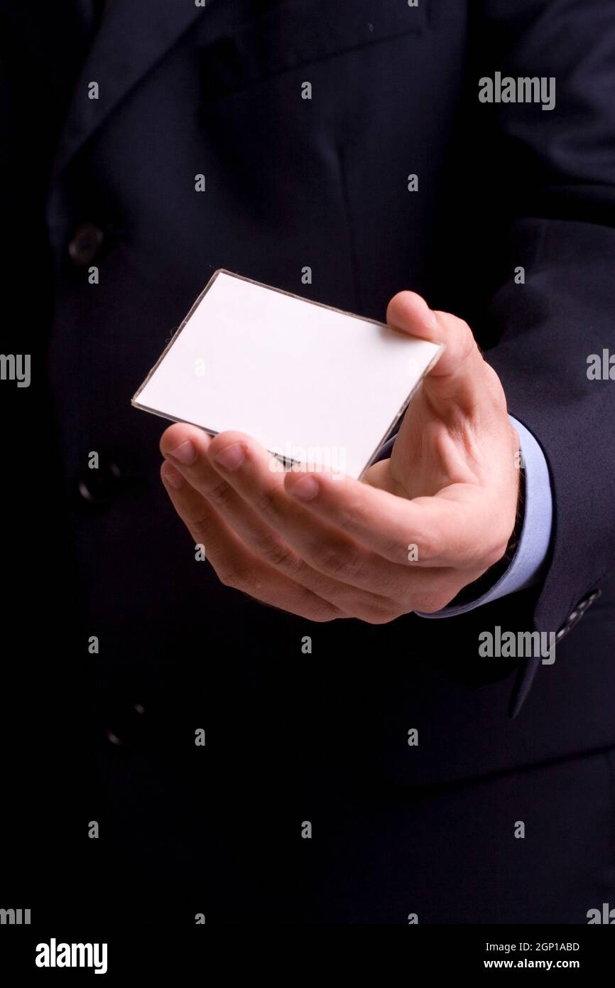 Hand of businessman offering businesscard over white background Stock ...