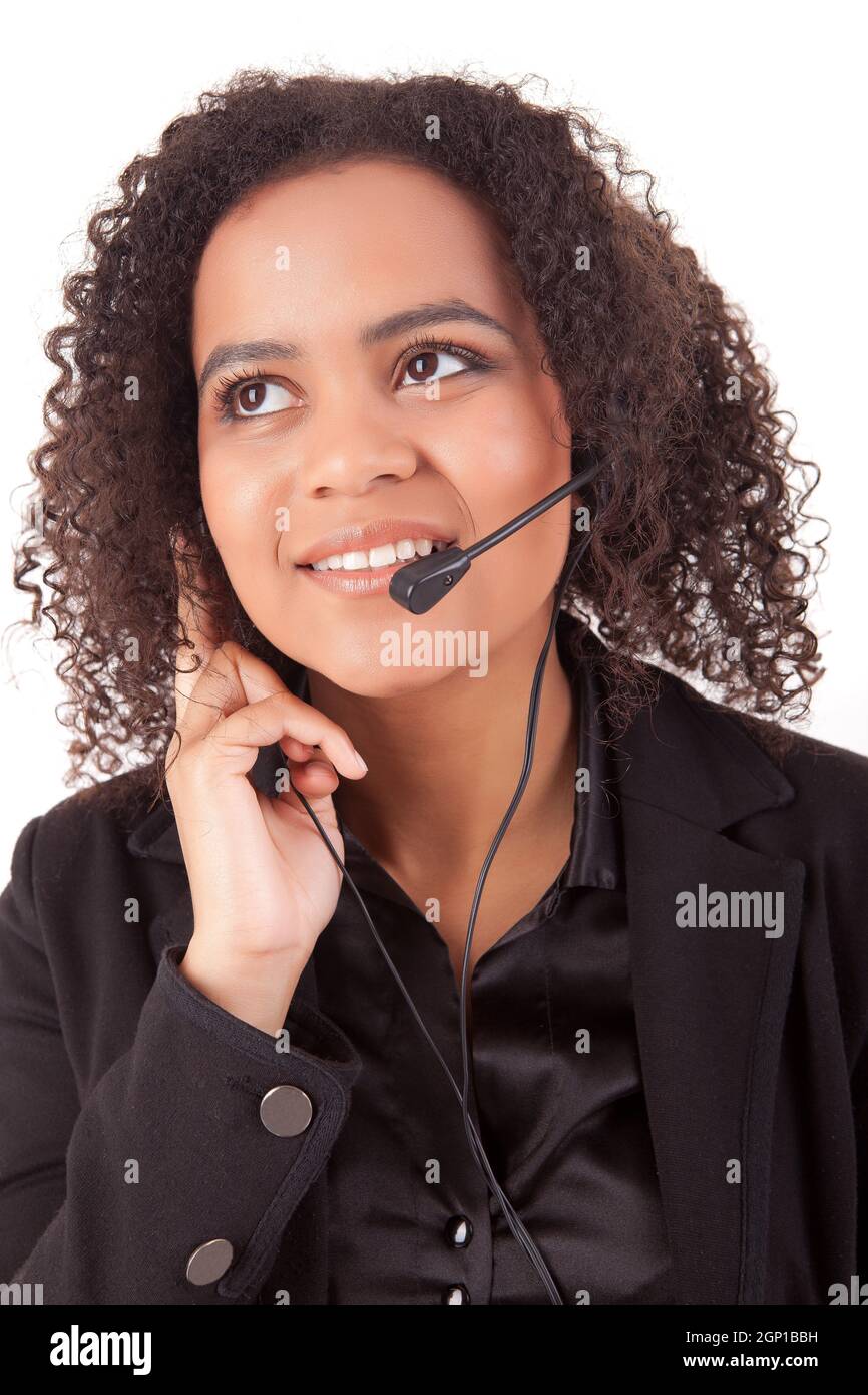 Friendly young beautiful telephone operator at work Stock Photo - Alamy