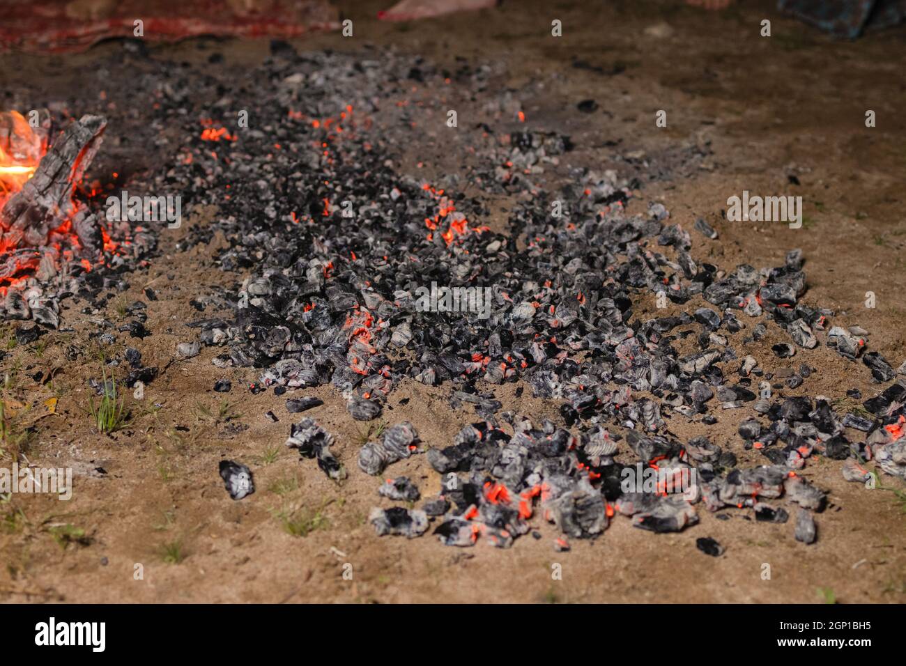Walking on the burning cinders close-up side view Stock Photo - Alamy