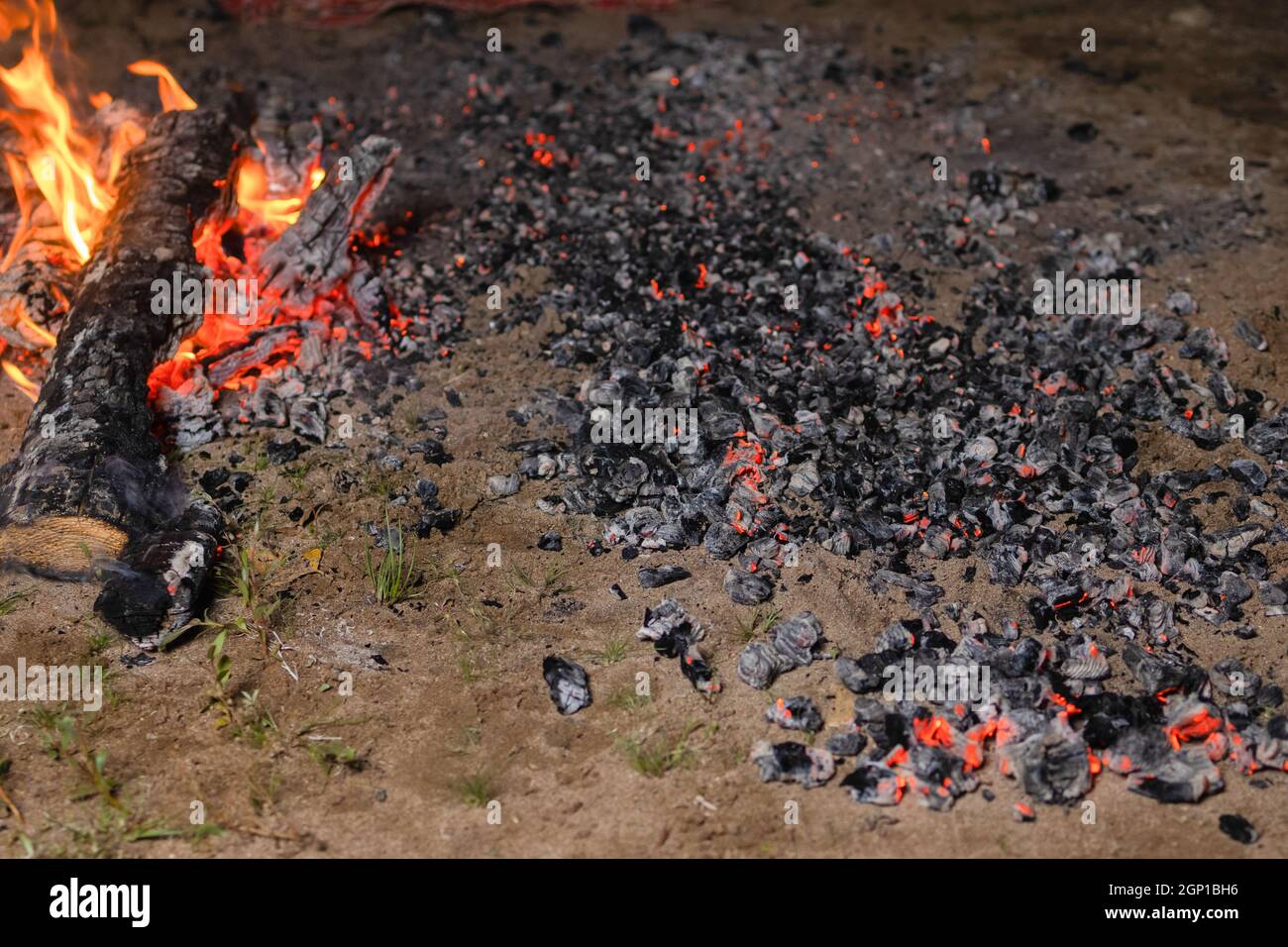 Walking on the burning cinders close-up side view Stock Photo - Alamy