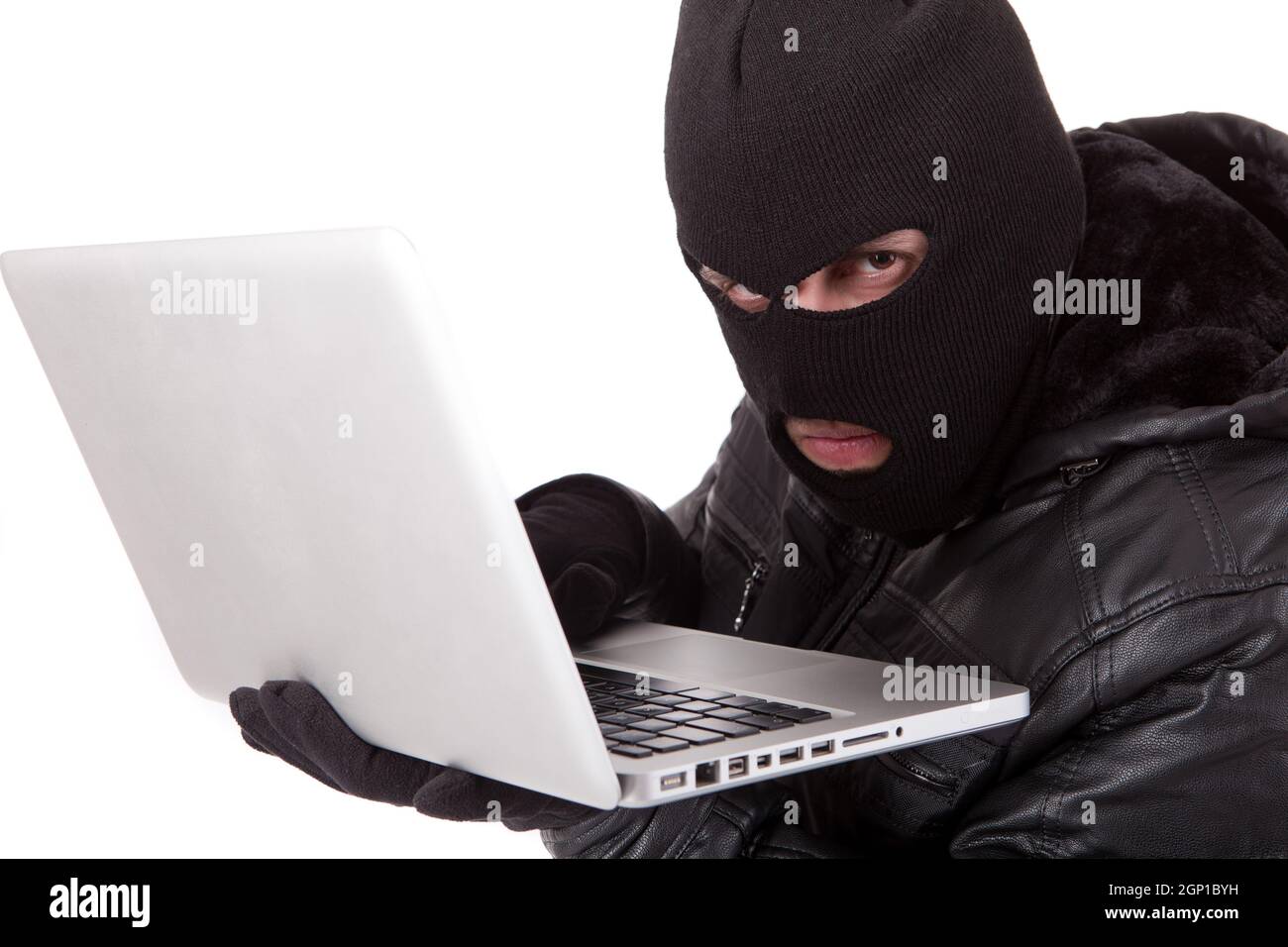 Disguised computer hacker hi-res stock photography and images - Alamy