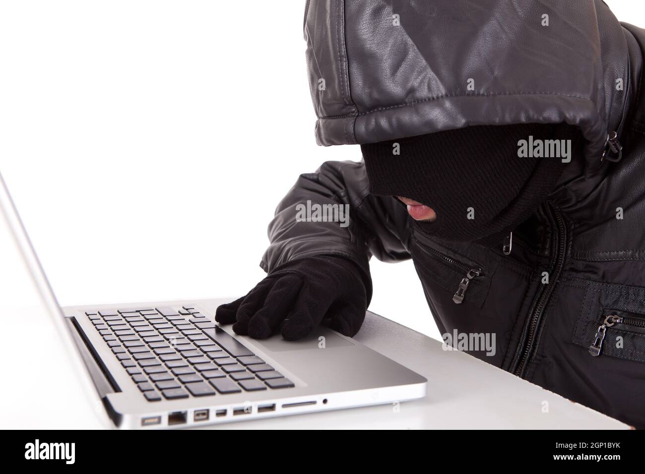 Disguised computer hacker hi-res stock photography and images - Alamy