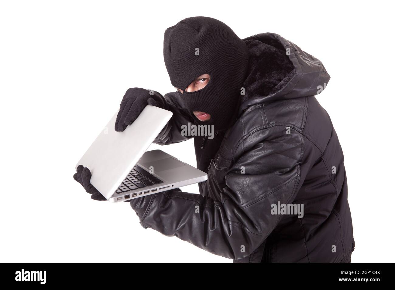Computer hacker with white laptop Stock Photo - Alamy