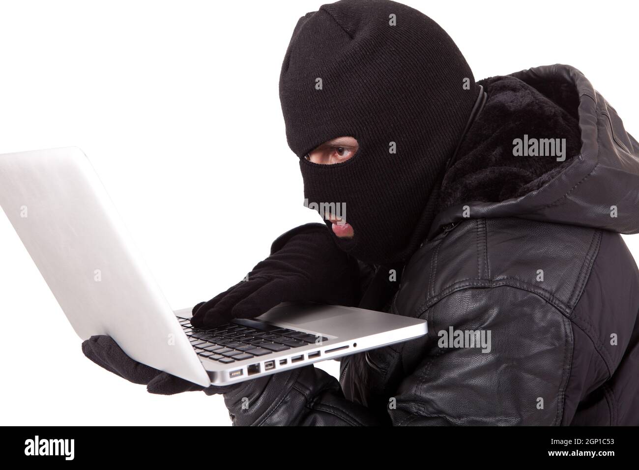 Disguised computer hacker hi-res stock photography and images - Alamy